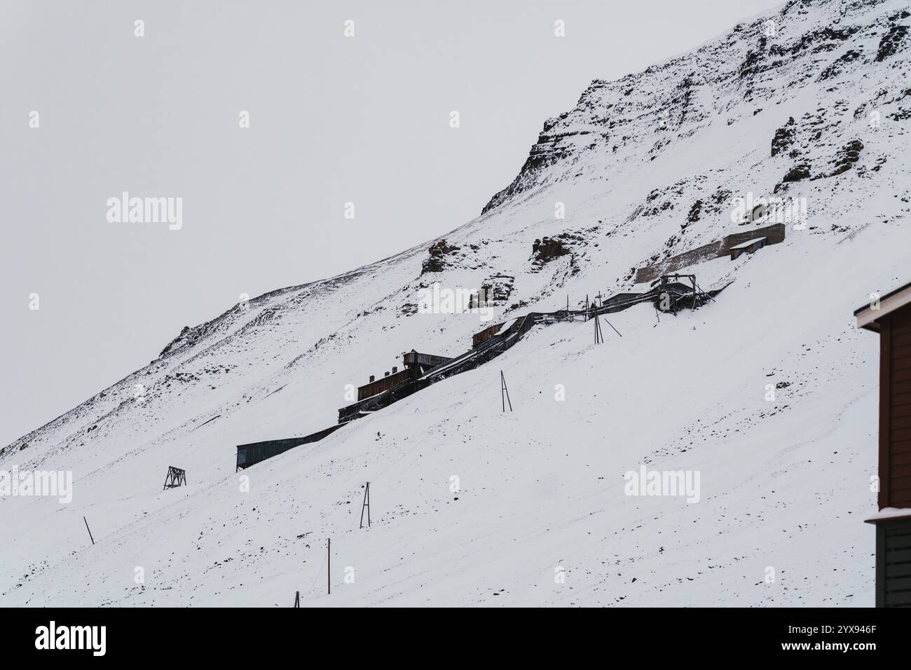 Coal mine abandoned on the side of snowy mountain in Longyearbyen ...