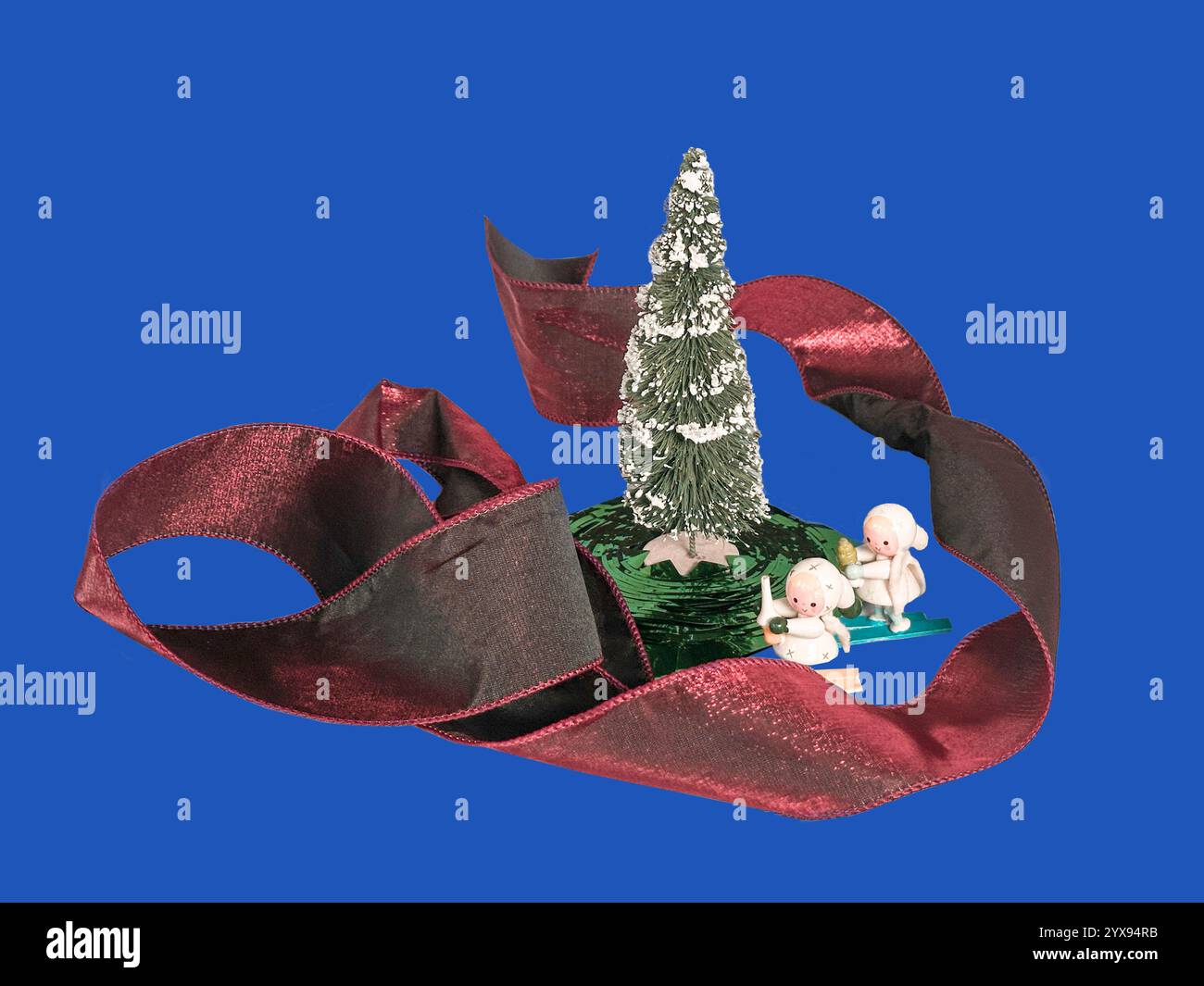 Skier wood figures outdoors near snow covered Christmas tree welcome ...