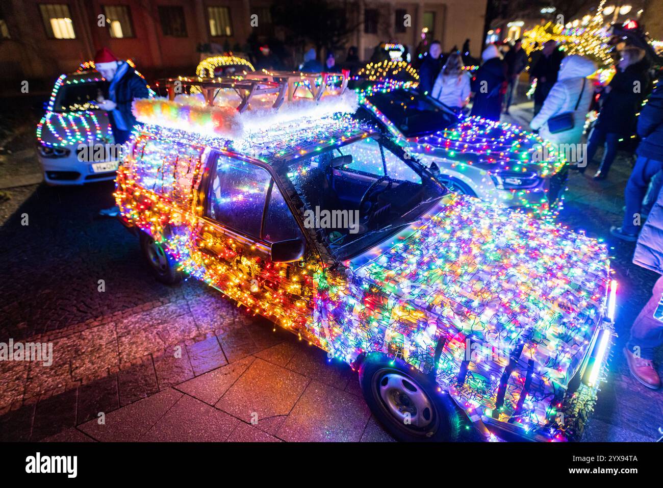 Hanover, Germany. 14th Dec, 2024. Several vehicles decorated with fairy ...