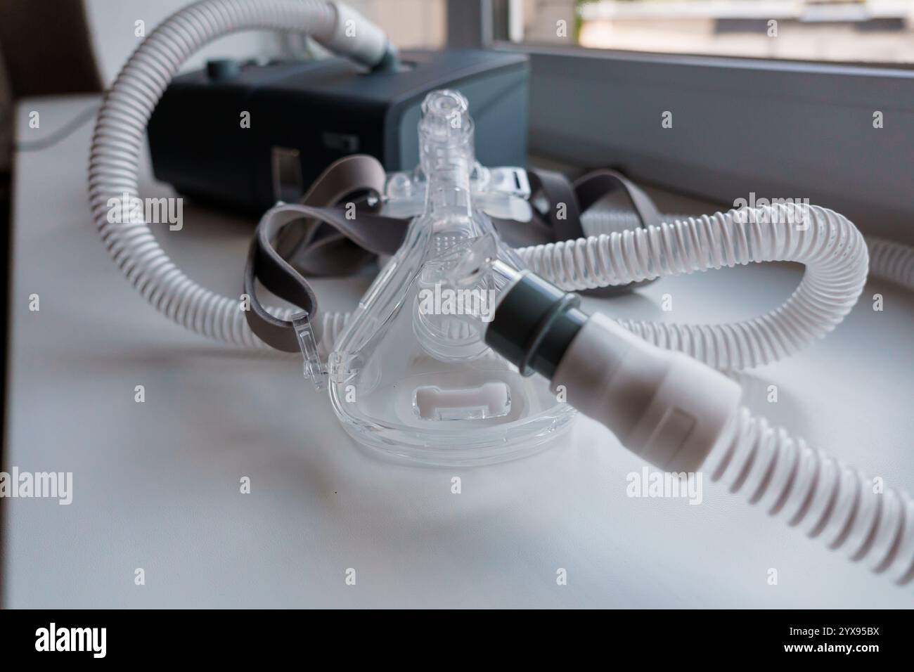 Advanced CPAP Machine with Attached Mask and Tubing on a Windowsill ...