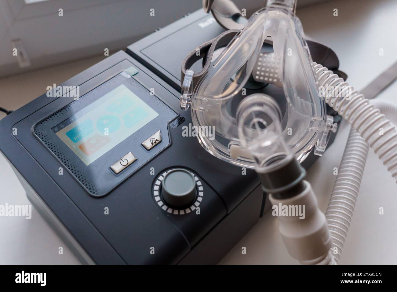 Advanced Sleep Therapy Equipment with Respiratory Mask Stock Photo - Alamy