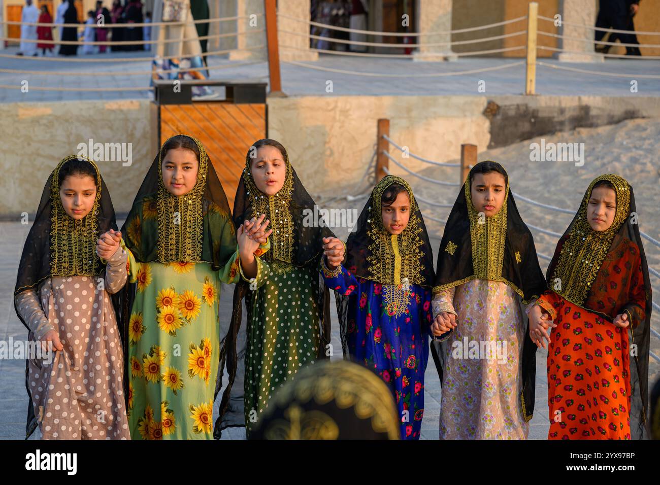 Doha, Qatar, December 13, 2024: Children occasionally wear traditional ...