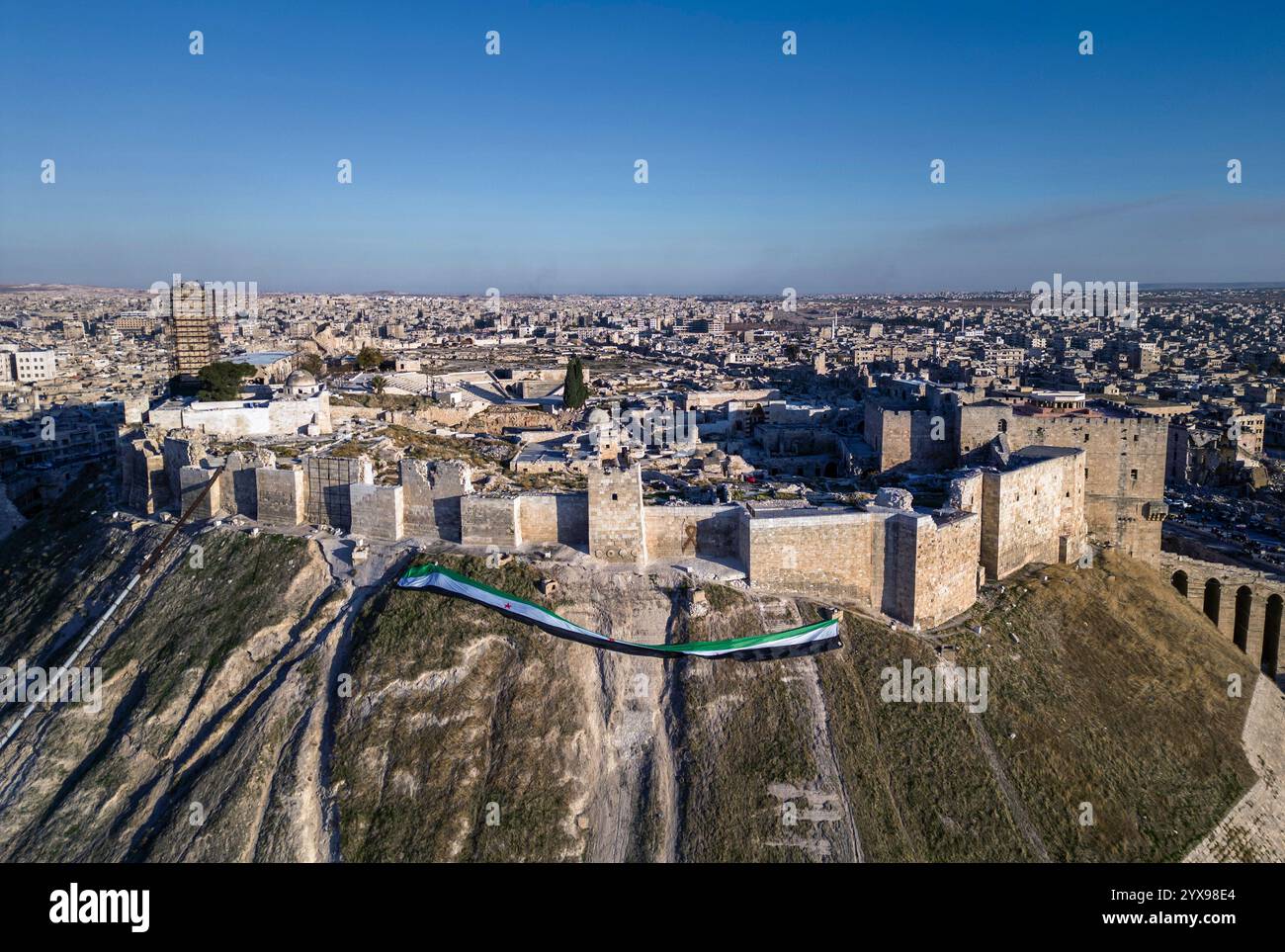 An arial shot shows the ancient Aleppo Citadel decorated with the ...