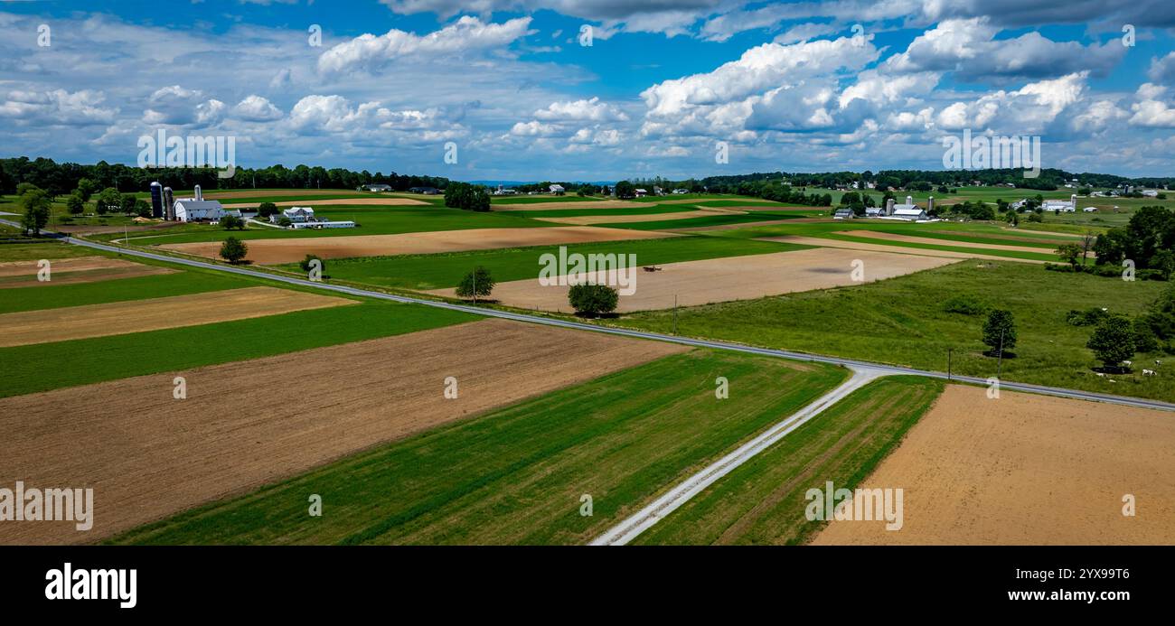 Vast agricultural fields dominate the landscape, showcasing a mix of ...