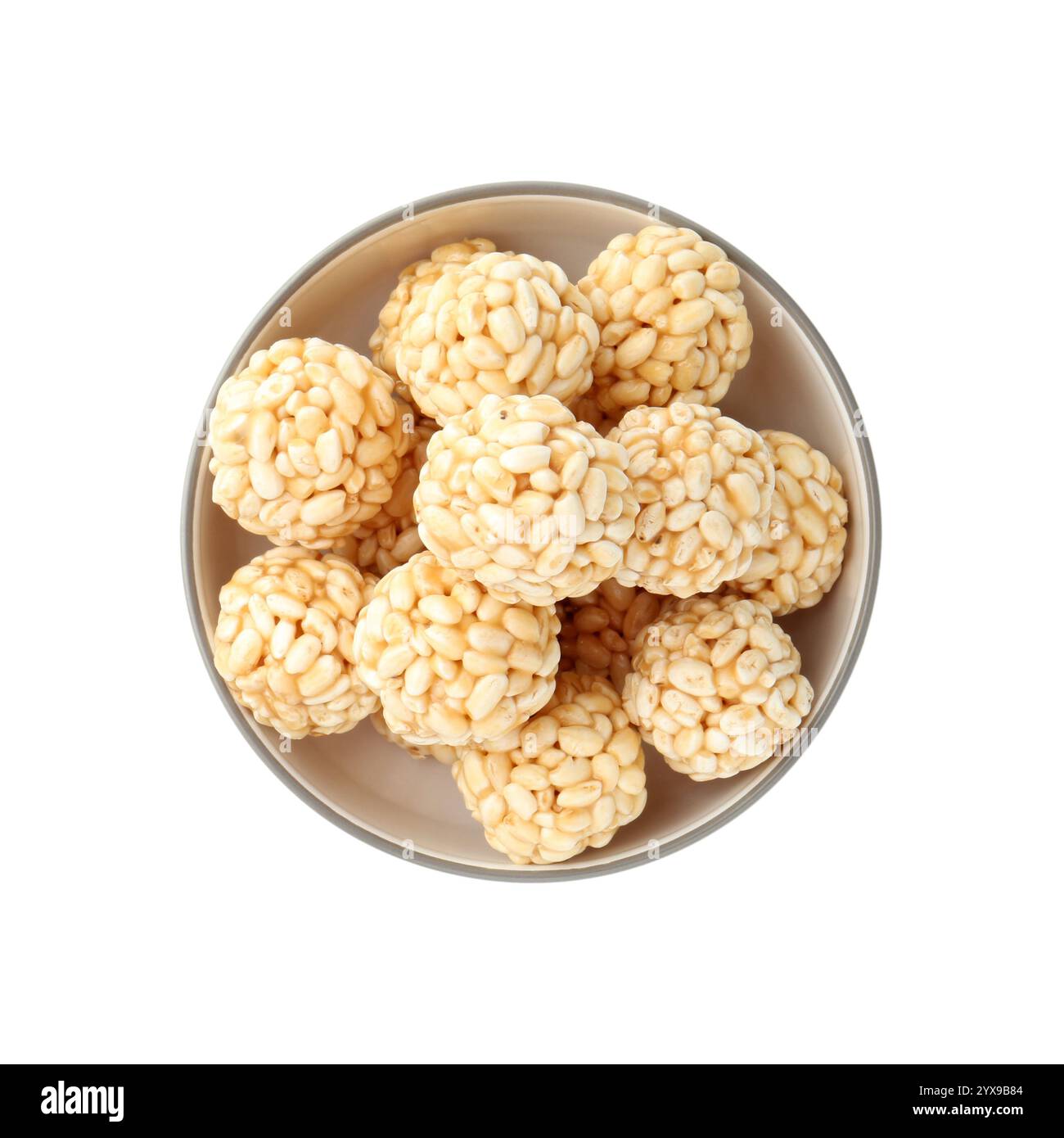 Delicious puffed rice balls in bowl isolated on white, top view Stock ...