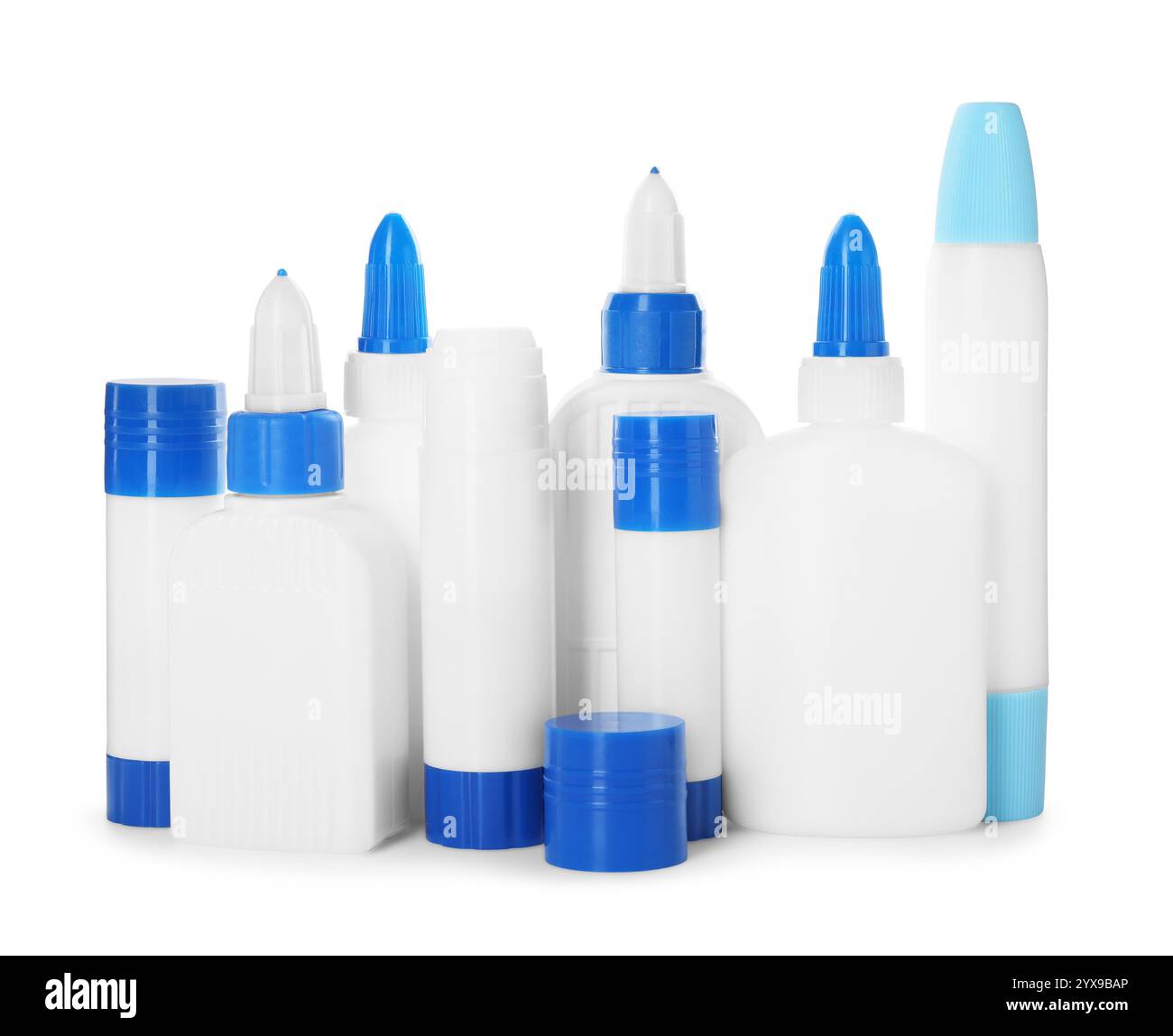Bottles and sticks of glue on white background Stock Photo - Alamy