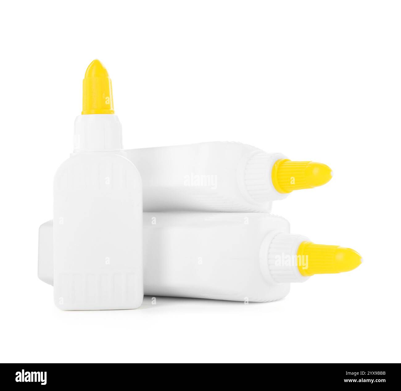 Bottles of glue with caps isolated on white Stock Photo - Alamy