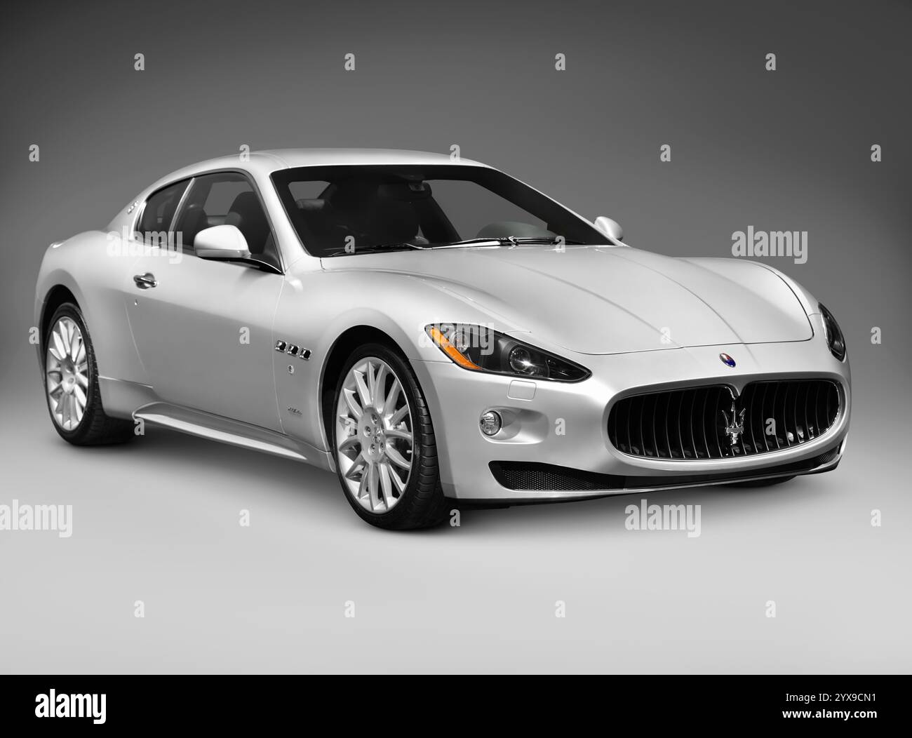 2010 Silver Maserati GranTurismo two-door coupe luxury car. Isolated on ...