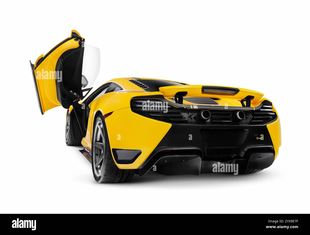 Yellow 2014 McLaren 12C supercar with open butterfly door rear view ...