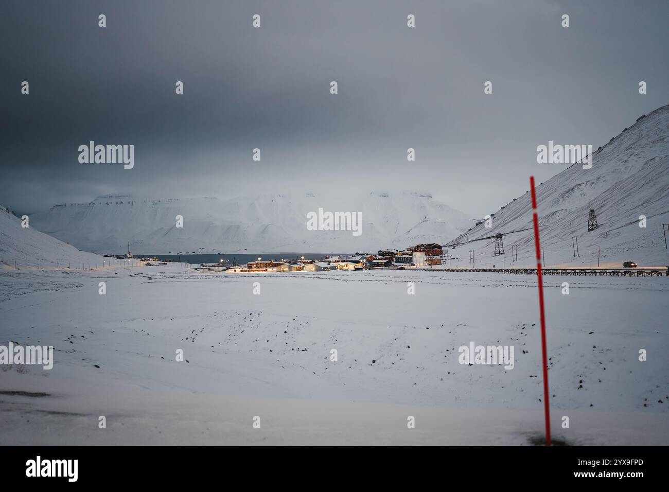 View of Longyearbyen, Svalbard down snowy valley from Nybyen Stock ...
