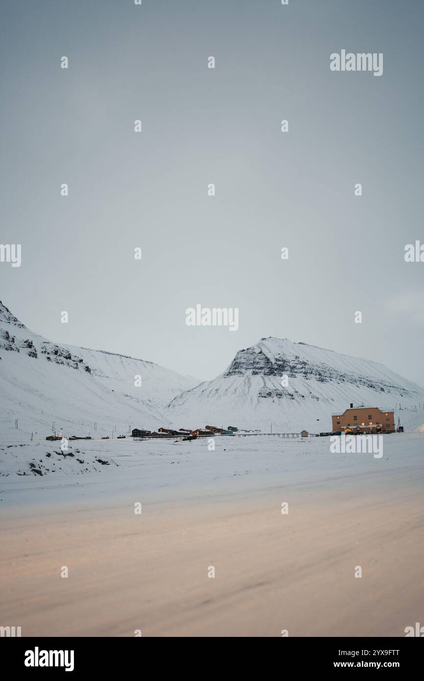 Snowy valley with Nybyen under Sarkofagen in Longyearbyen, Svalbard ...
