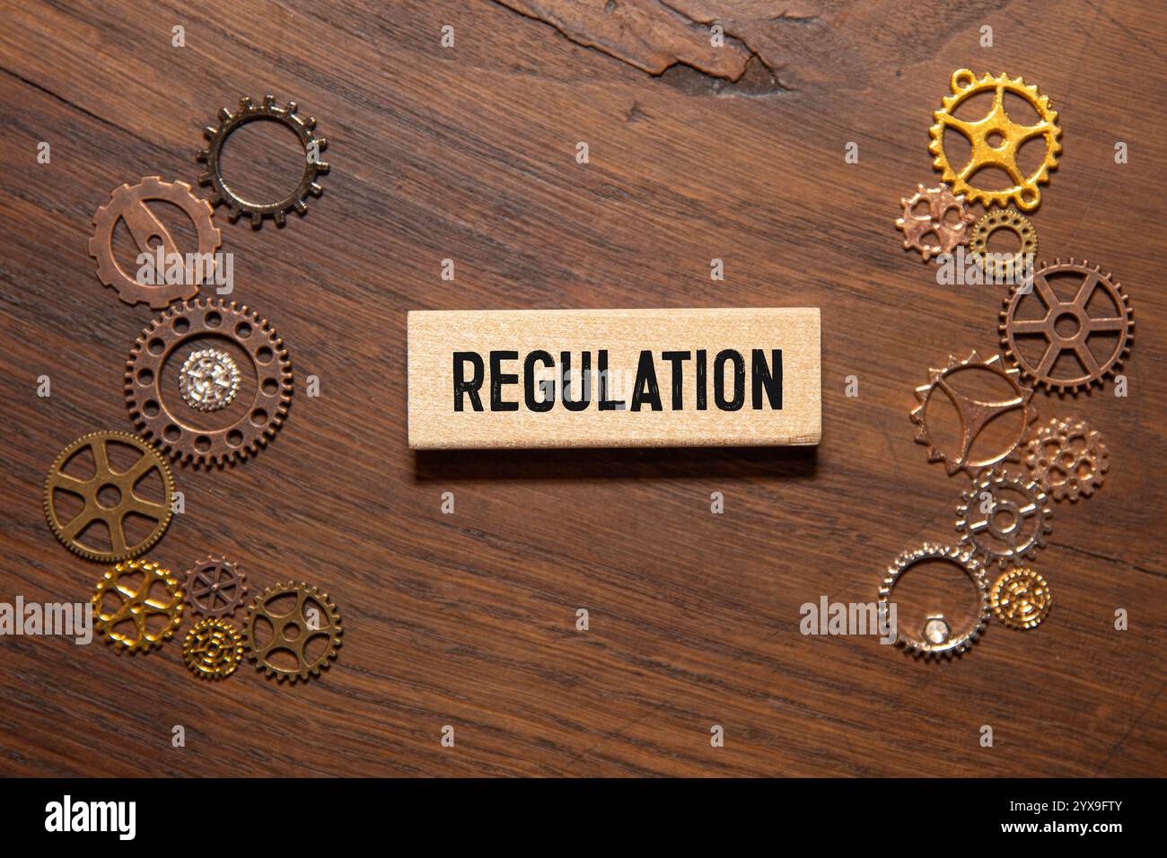 Macro photo of tooth wheel mechanism with REGULATION concept related ...