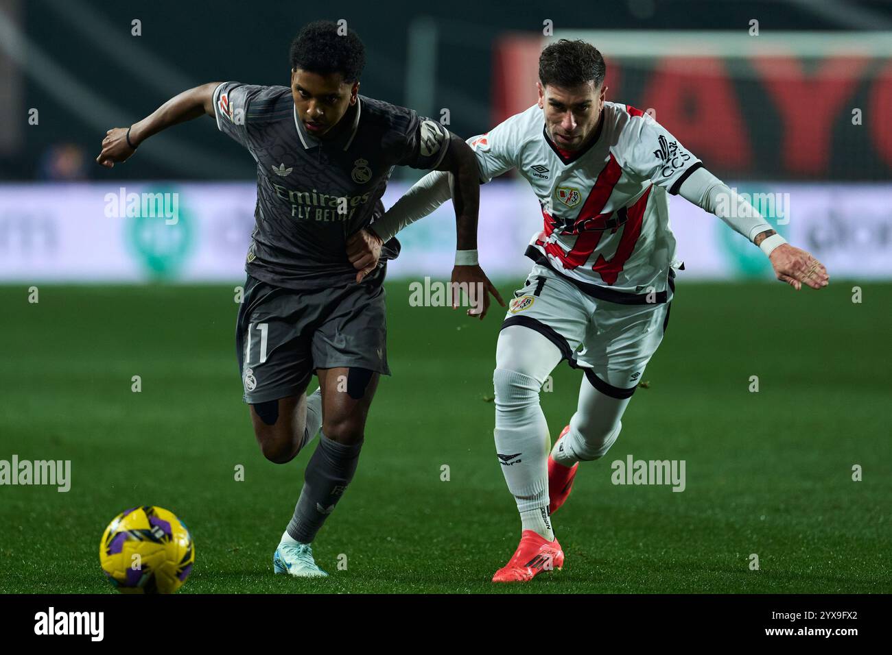 Rodrygo Goes of Real Madrid CF and Adrian Embarba of Rayo Vallecano ...