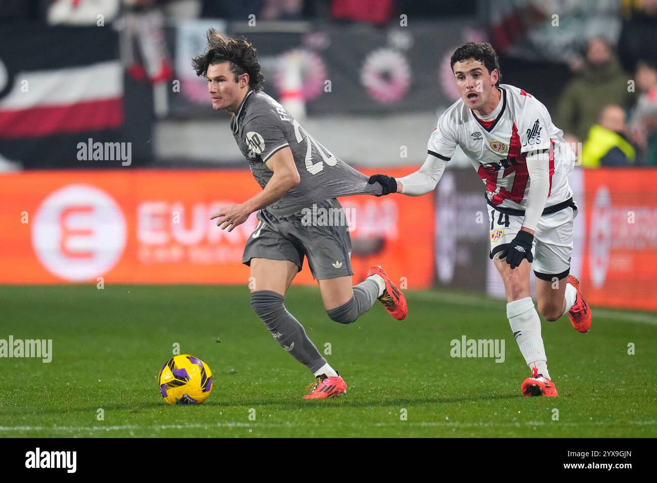 Real Madrid's Fran Garcia, left, challenges for the ball with Rayo's ...