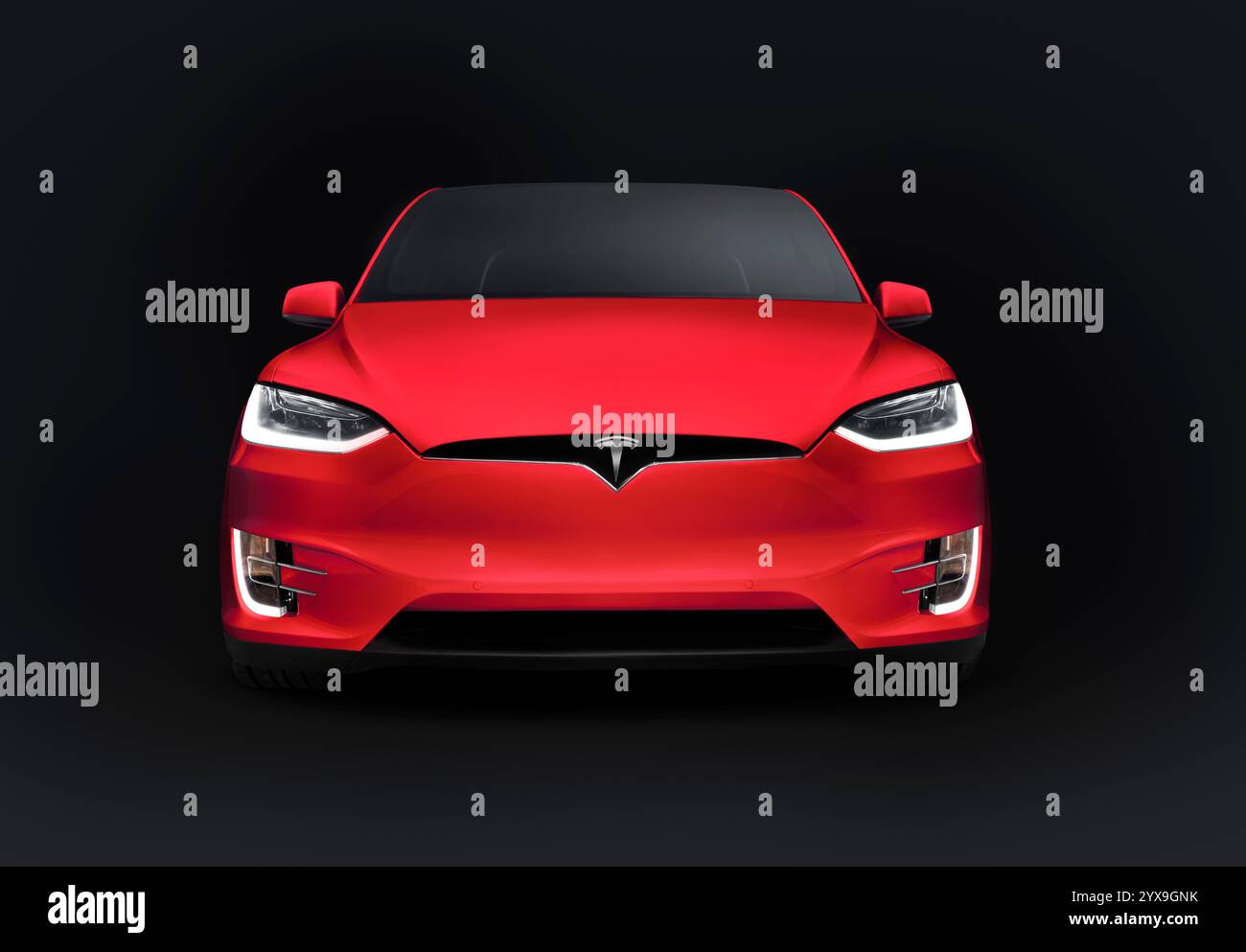 Red Tesla Model X, front view of a luxury SUV electric car isolated on ...