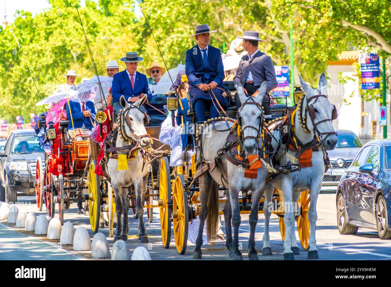 Seville cityscape with busy streets during April Fair fiesta. Cars and ...