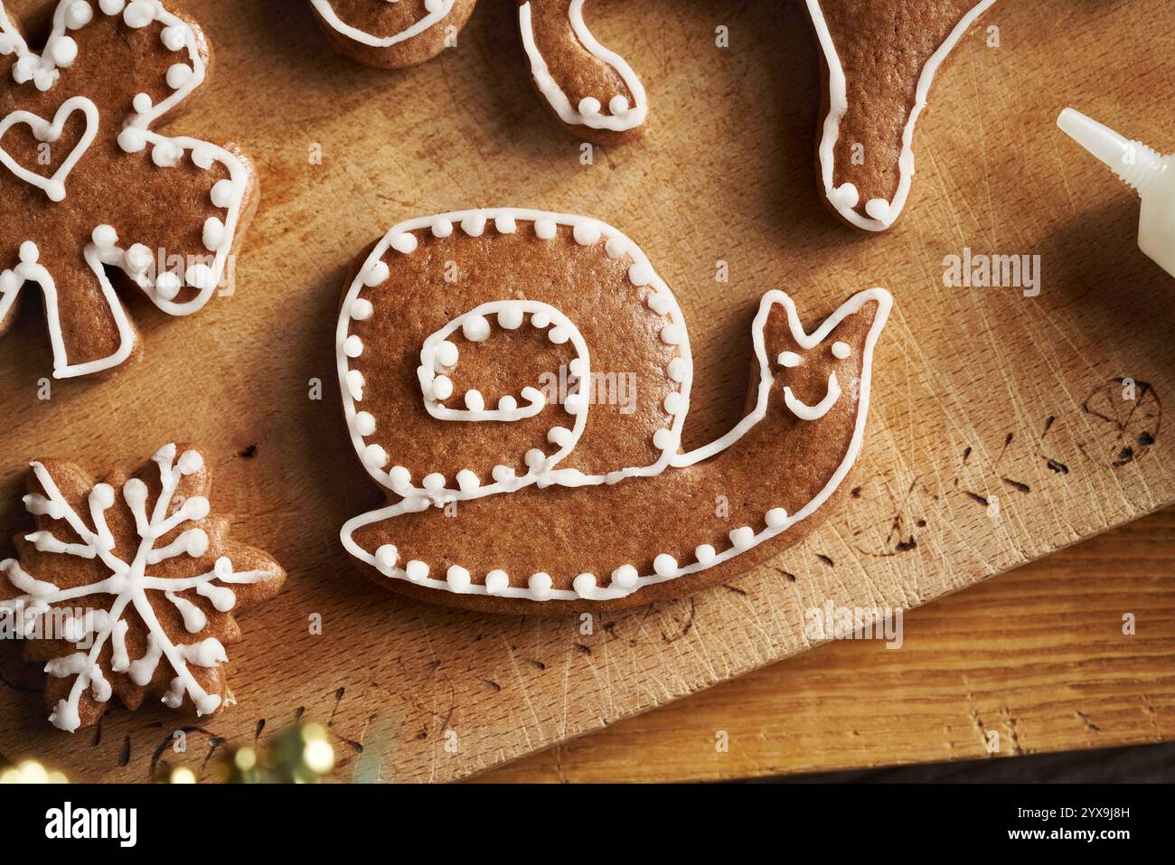 Homemade gingerbread Christmas cookie in the shape of a snail decorated ...
