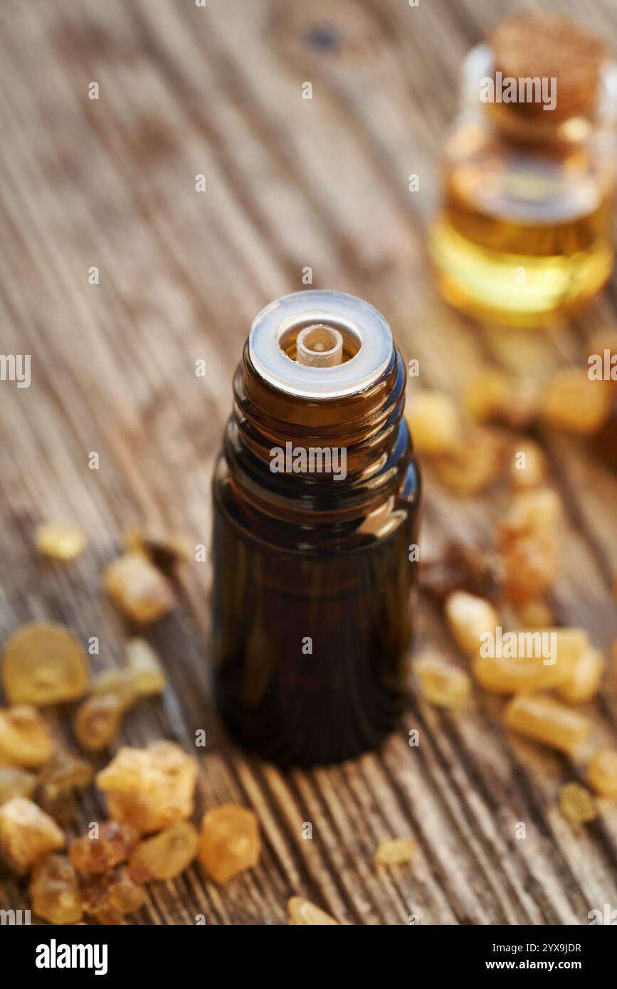 A brown bottle of frankincense essential oil with boswellia resin Stock ...