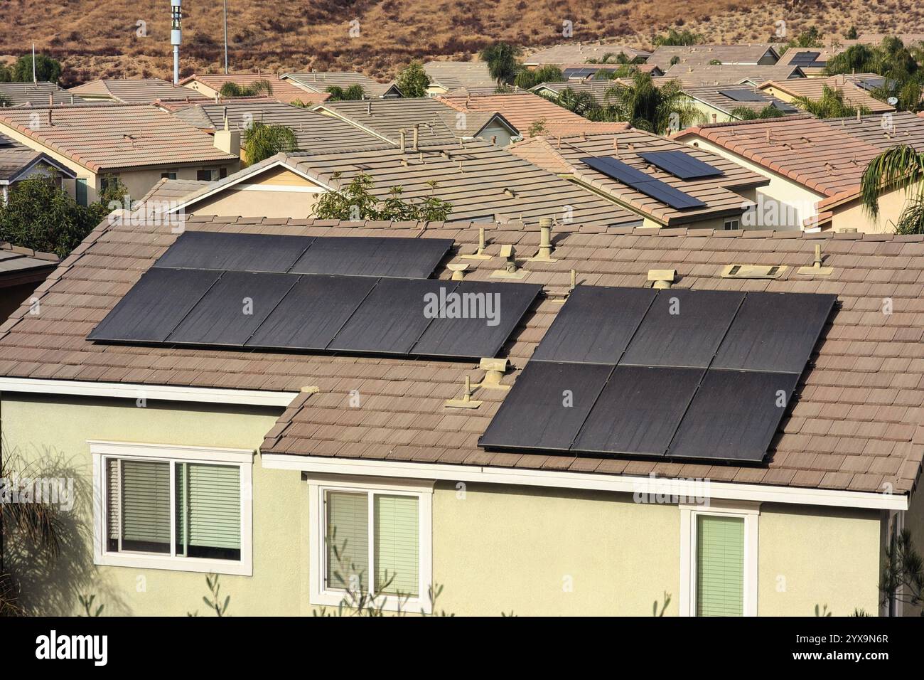 Solar panel array installed on the roofs of a number of residences ...