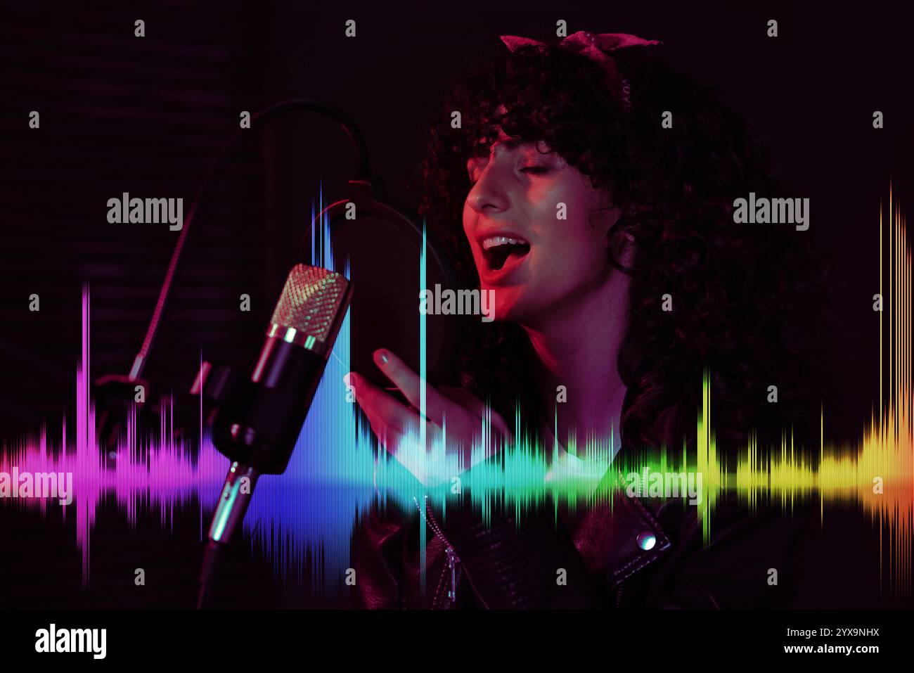 Vocalist singing into microphone in professional record studio. Sound ...