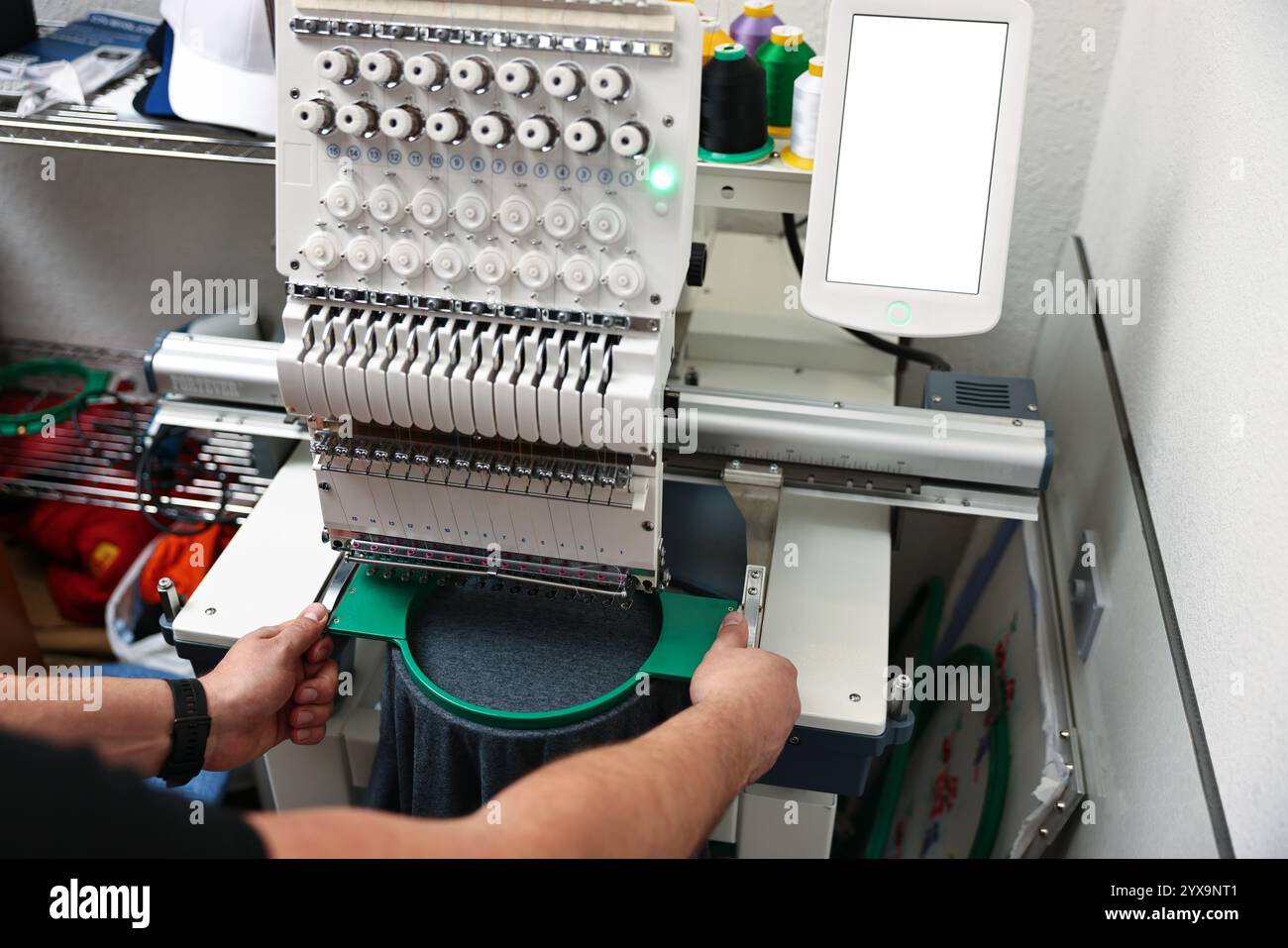 Man using embroidery machine hi-res stock photography and images - Alamy