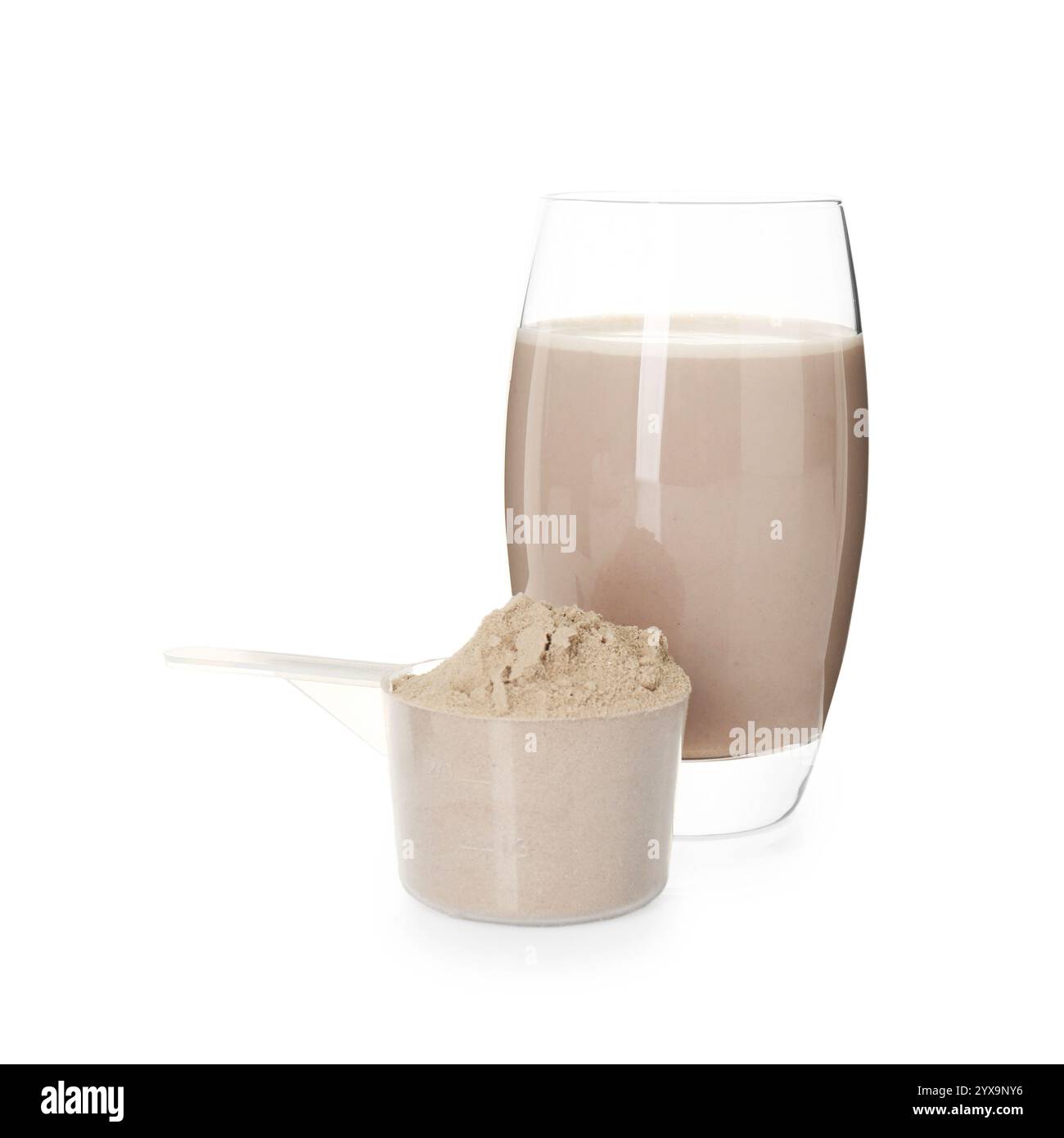Delicious protein shake in glass and scoop with powder isolated on ...