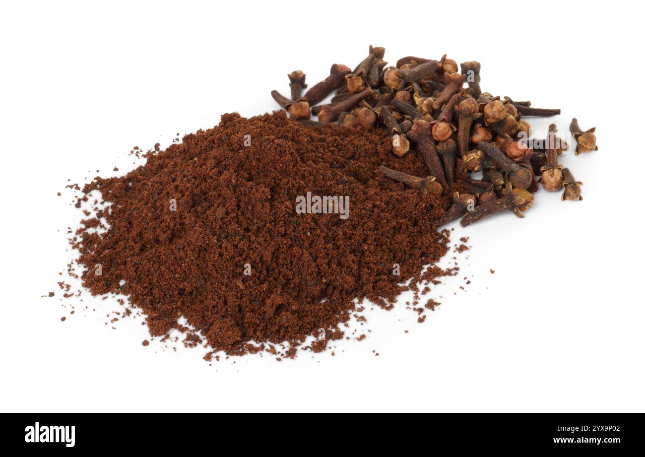 Pile of clove powder and dried buds on white background. Aromatic spice ...