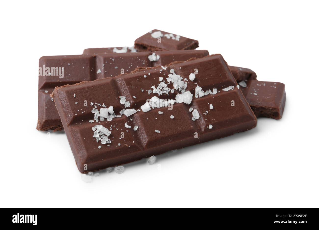 Pieces of chocolate with salt isolated on white Stock Photo - Alamy