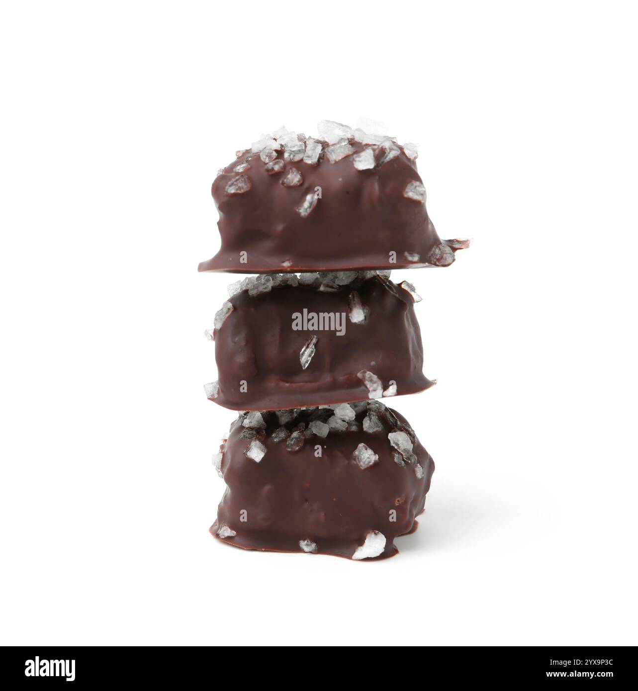 Stack of tasty chocolate candies with salt isolated on white Stock ...
