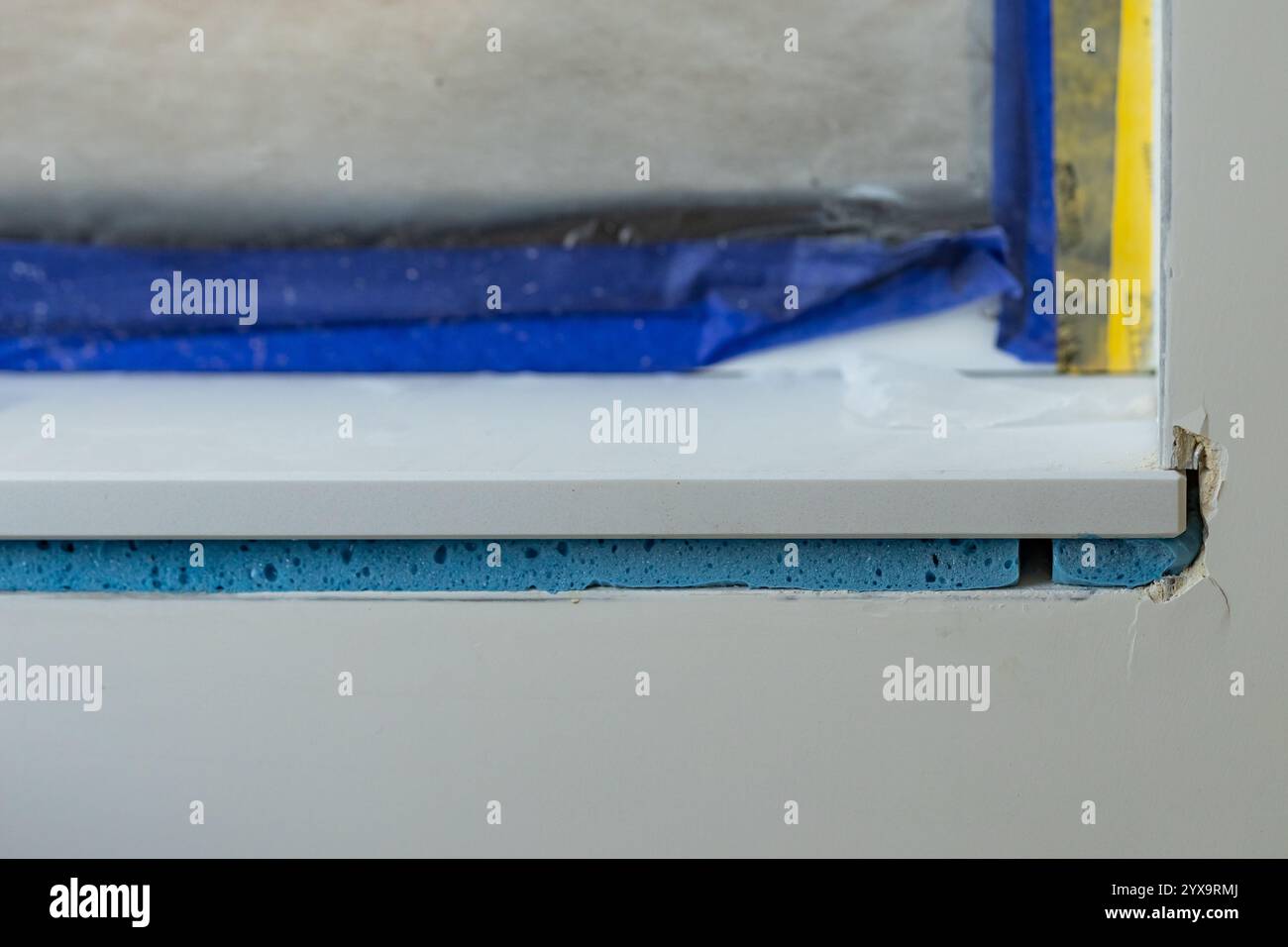 Close-up of a window sill under construction with visible layers of ...