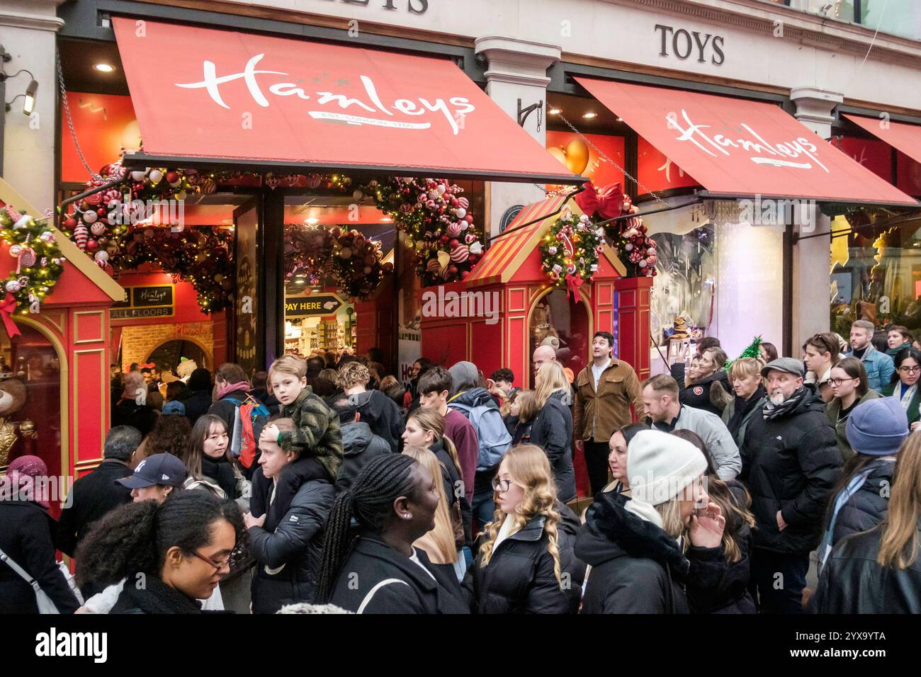 14th December 2024, London. Christmas shoppers queue to enter the ...