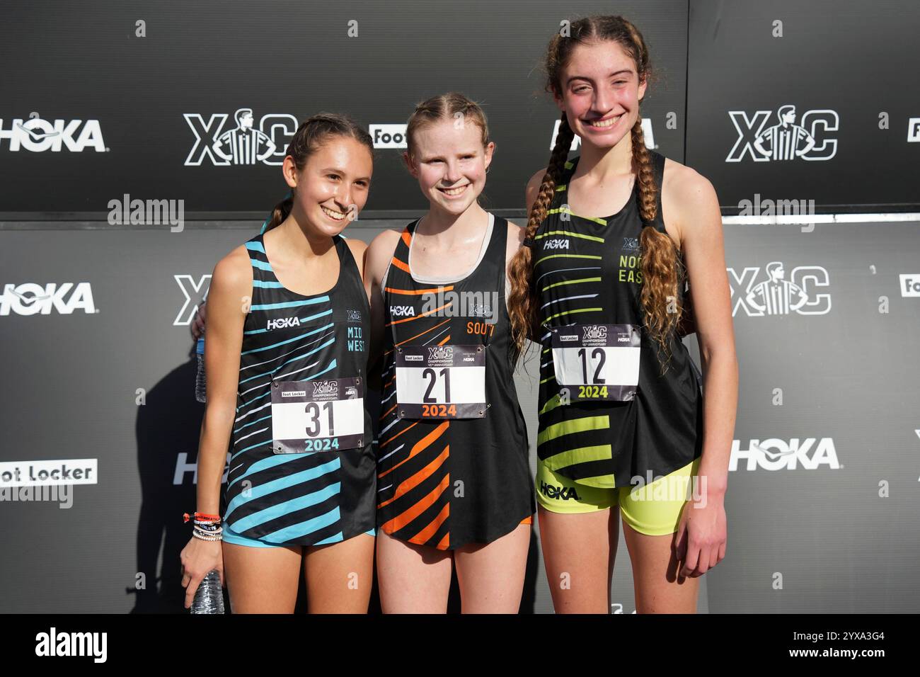 Girls winner Elizabeth Leachman (center) poses with runner-up Victoria ...