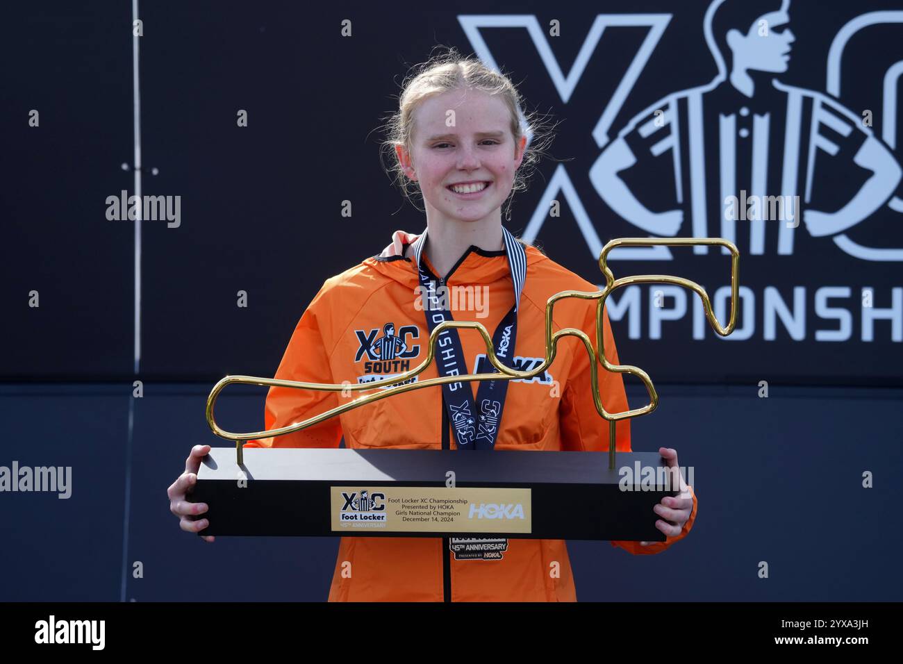 Elizabeth Leachman poses with winner's trophy after winning the girls ...