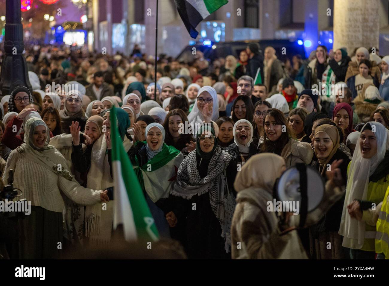 Madrid, Spain. 14th Dec, 2024. A female protester chants slogans while ...