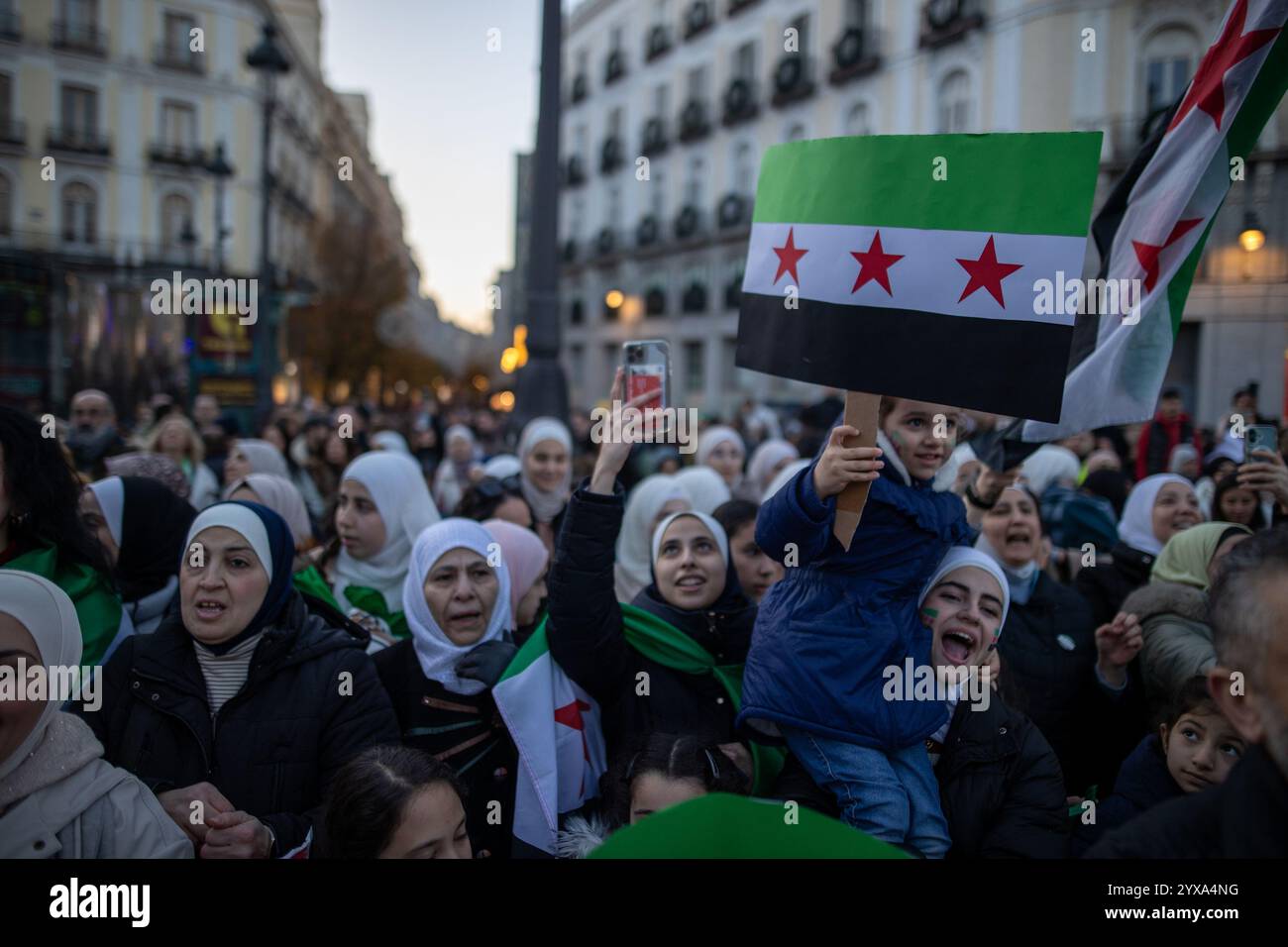 Protesters take part during a rally. Syrian residents in Madrid have ...