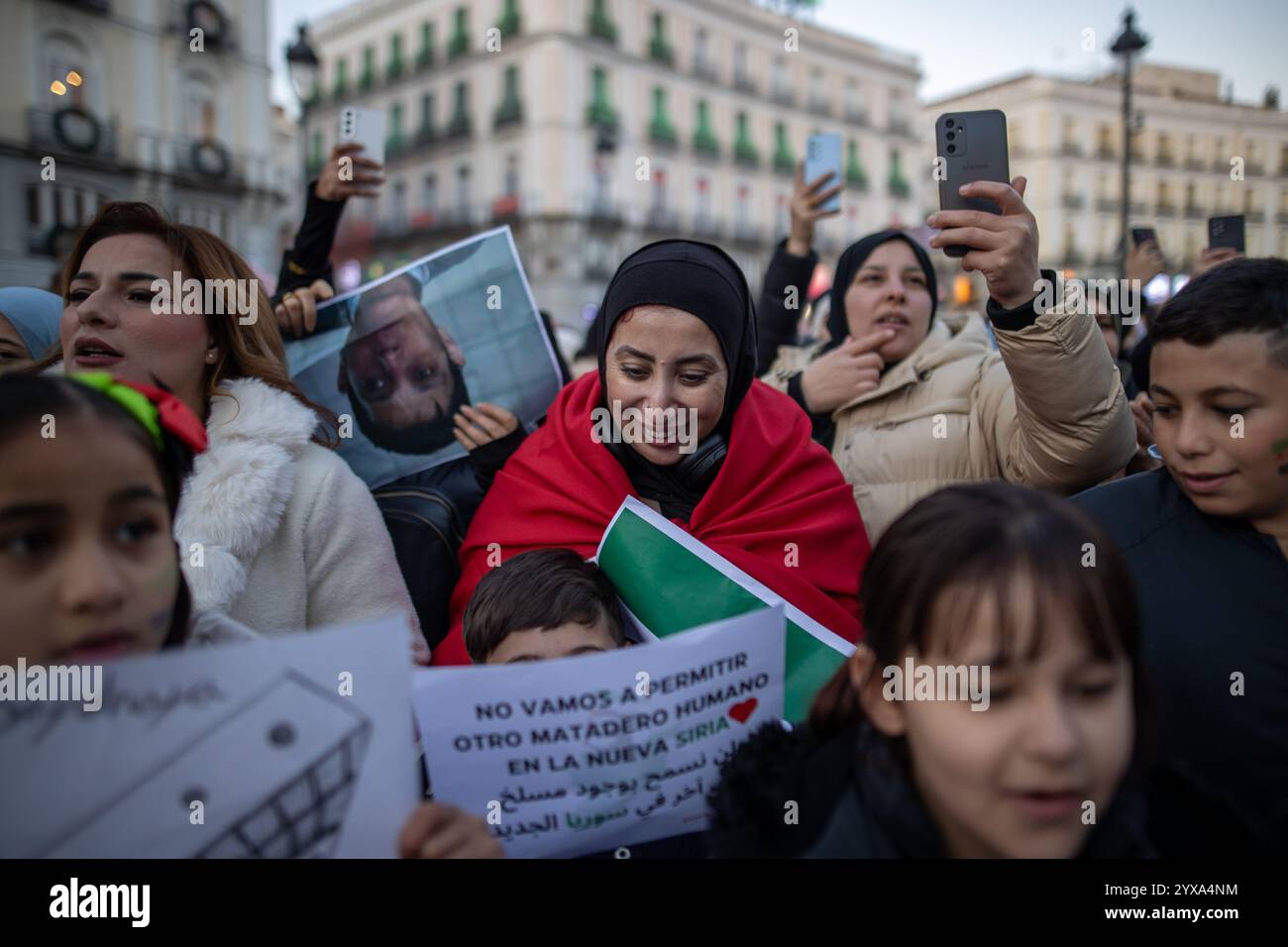 A woman with her son participates in a rally. Syrian residents in ...