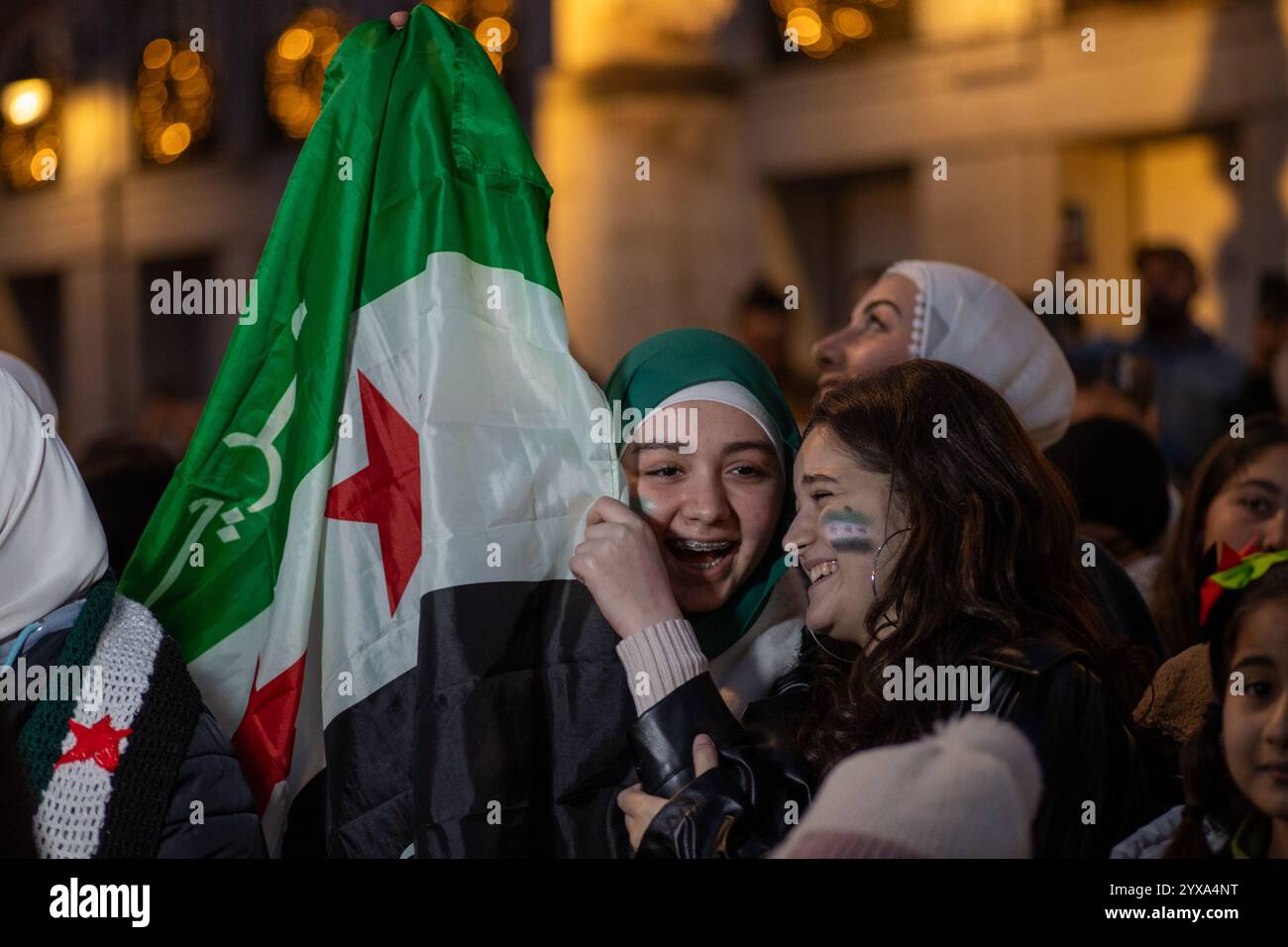 Madrid, Spain. 14th Dec, 2024. Protesters hold the Syrian flags during ...