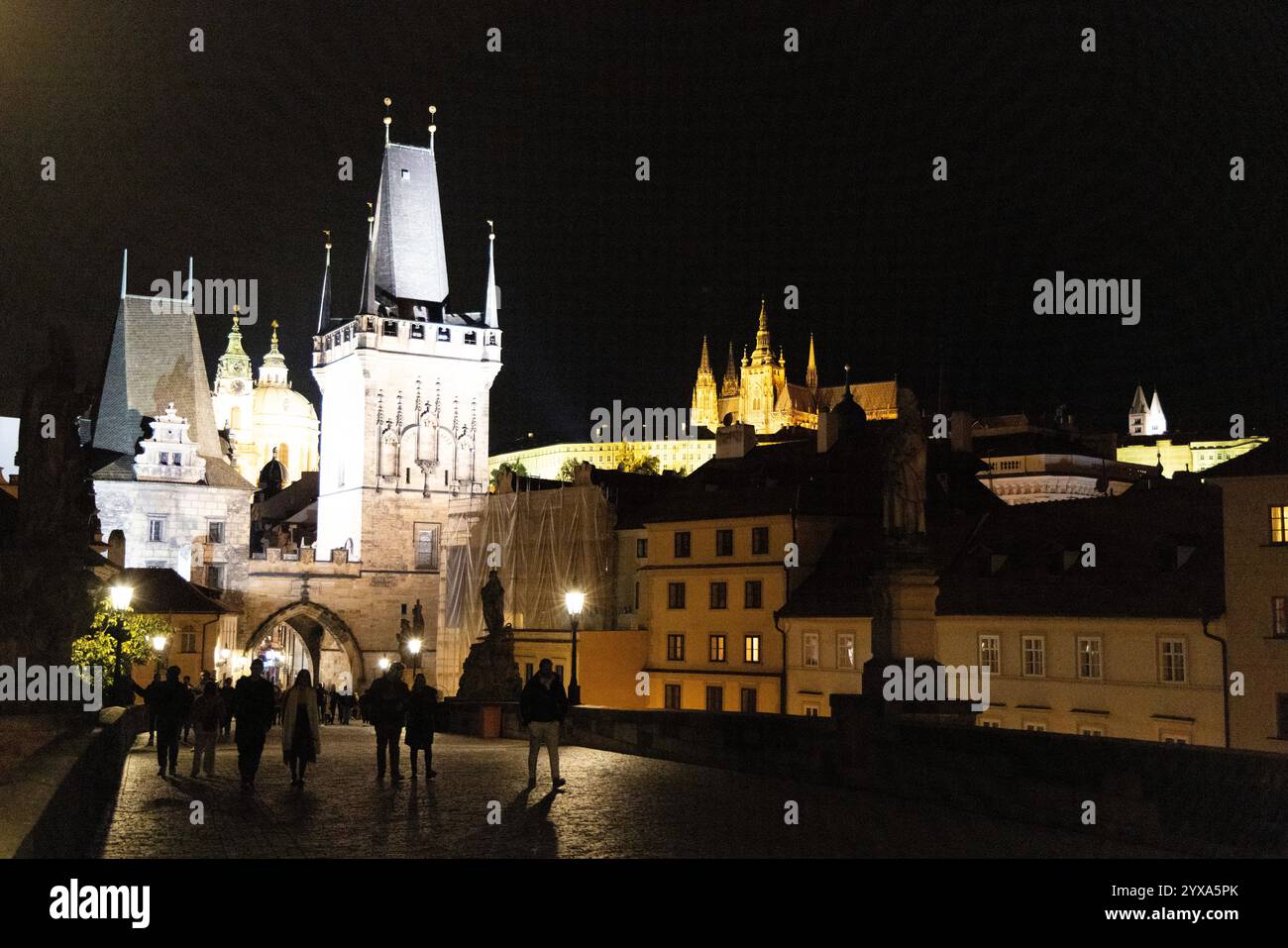 Charles Bridge and the lesser town tower illuminated at night with ...