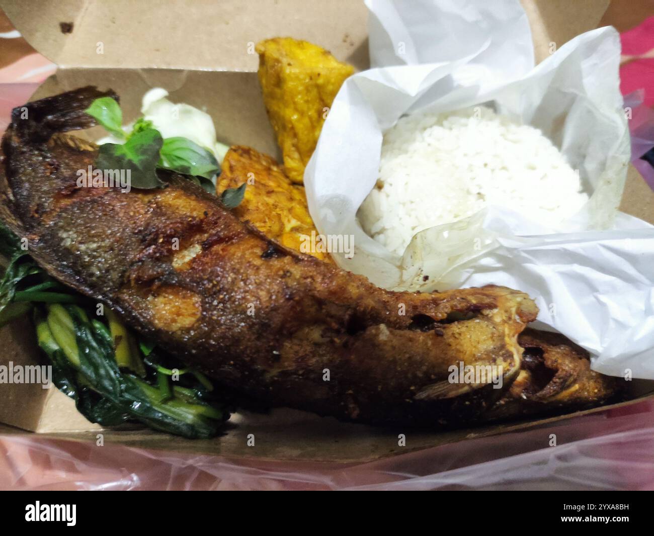 catfish pecel food consisting of catfish tempeh tofu Stock Photo - Alamy