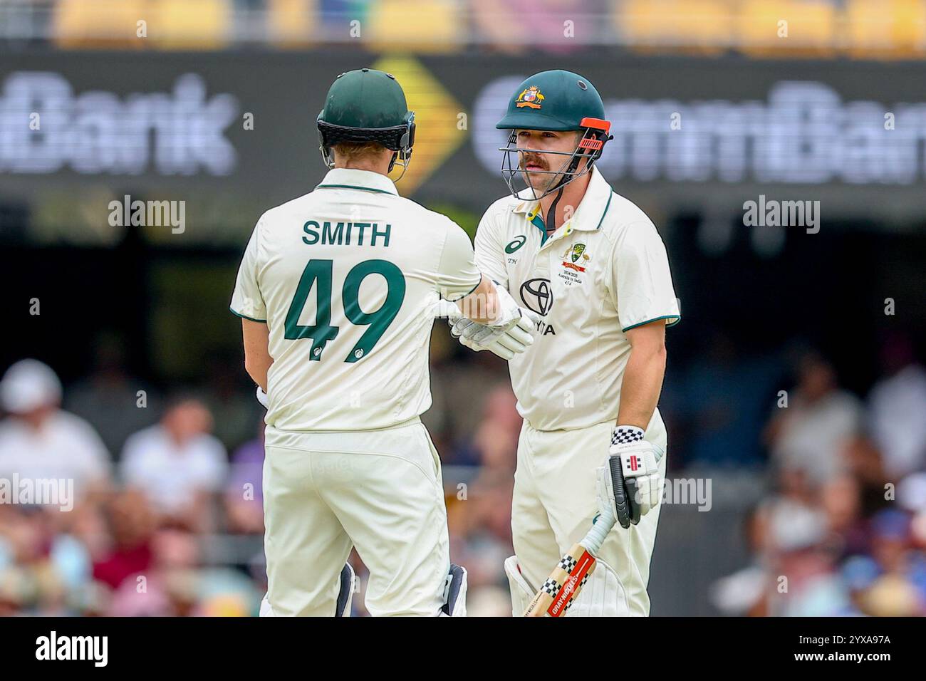 Australia's Steve Smith, left, fist bumps with batting partner Travis ...