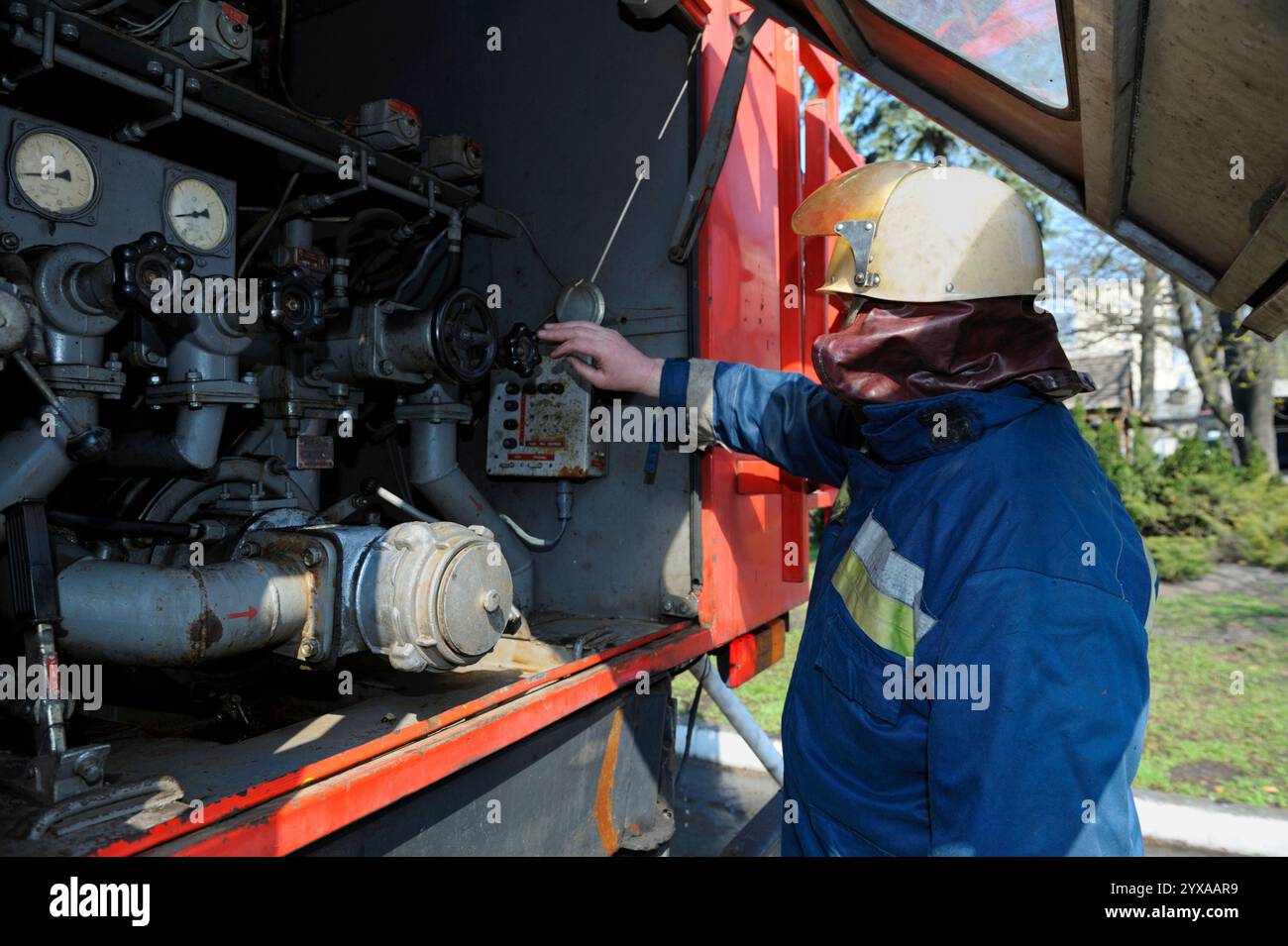 Fireman switching the water pump engine on control panel Stock Photo ...