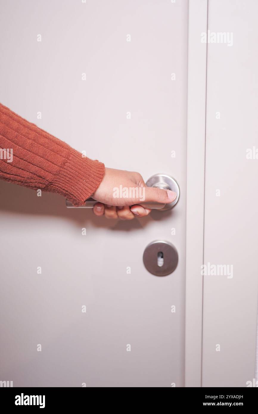 Hand reaching for door knob hi-res stock photography and images - Alamy