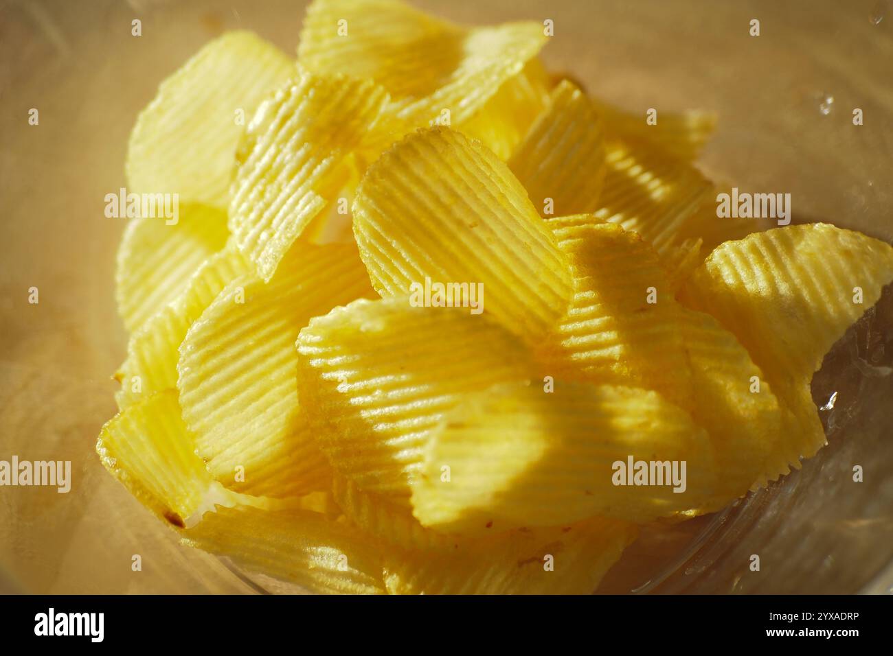 Enjoy a delightful serving of Crispy Potato Chips presented in a Bowl ...
