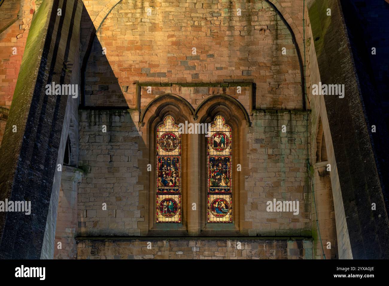 Pershore Abbey, Church of the Holy Cross, stained glass windows at dusk ...