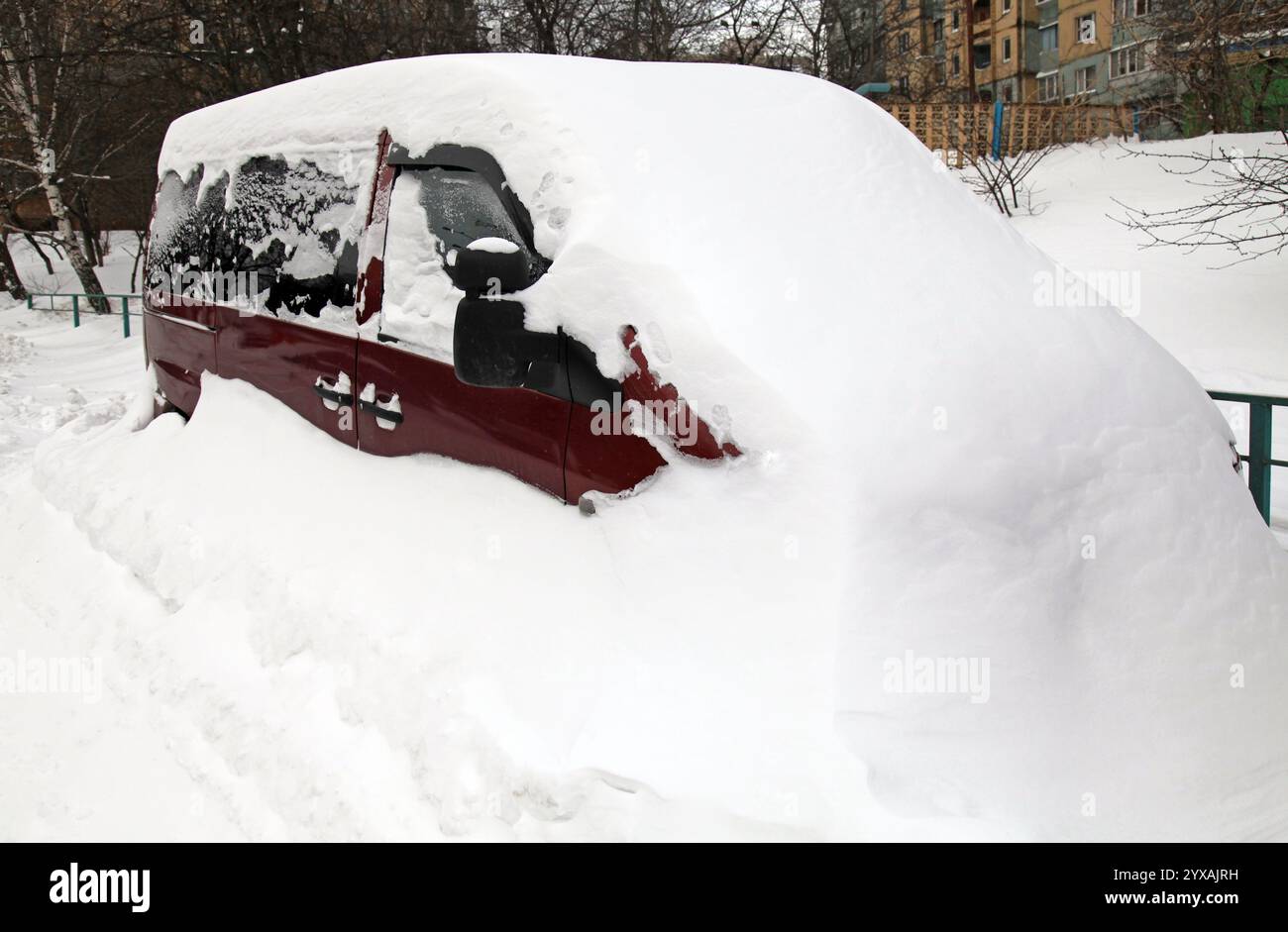 Snowy winter and snow-covered vehicles. Snowy car view covered in a ...