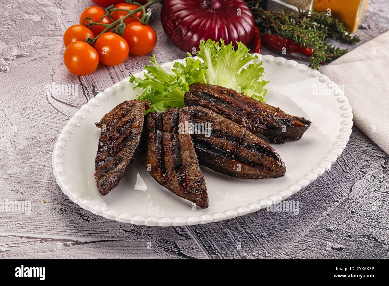 Grilled diet beef liver steak in the plate Stock Photo - Alamy