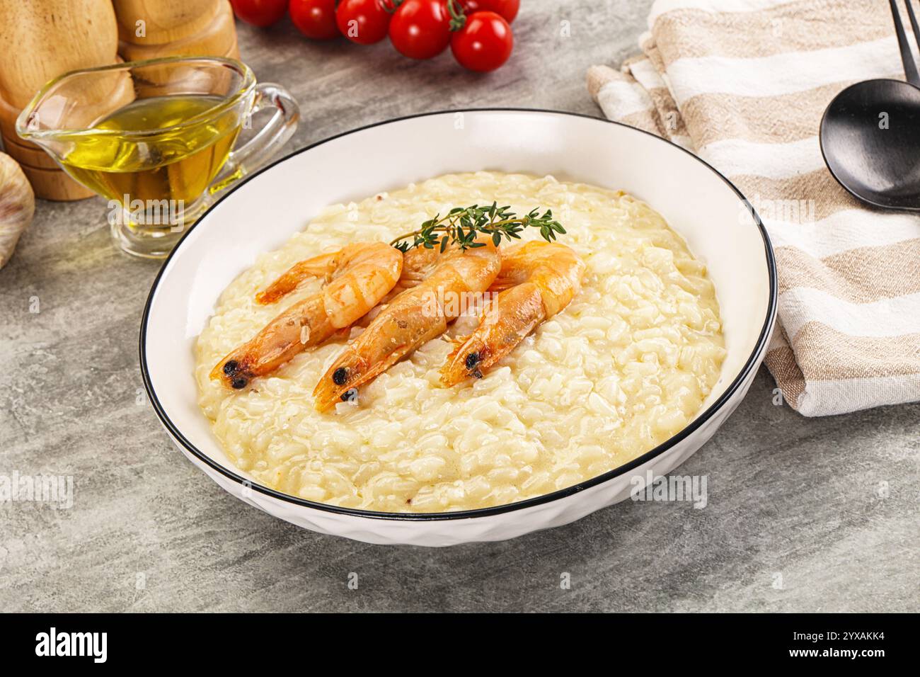 Italian cuisine - risotto with prawn served thyme Stock Photo - Alamy