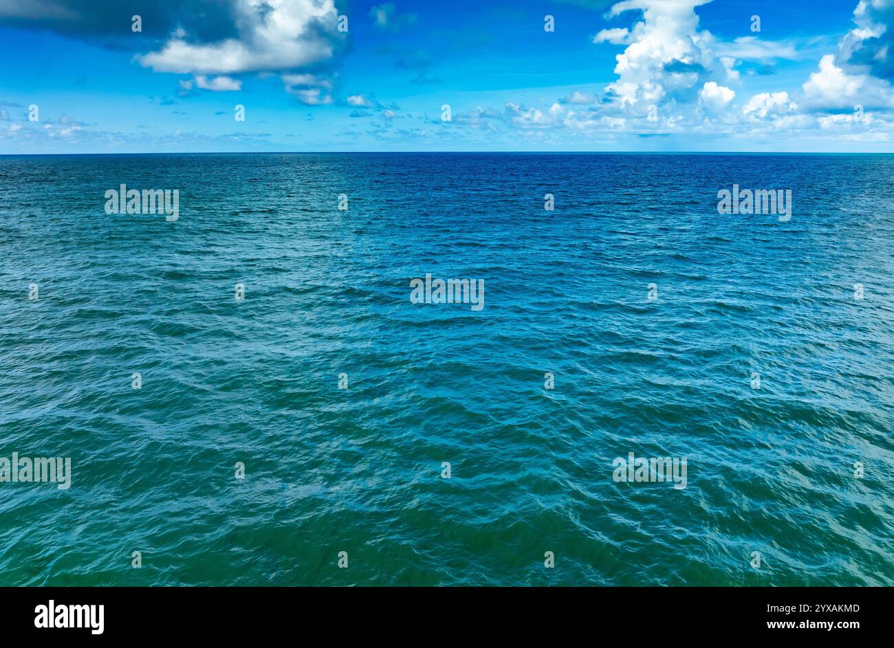 Aerial view of blue sea surface water texture background,Amazing sun reflections Aerial flying ...