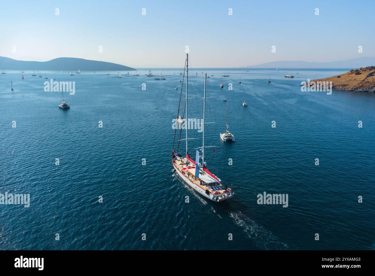 Aerial view of a white yacht crossing Bodrum Harbor, Turkey Stock Photo ...