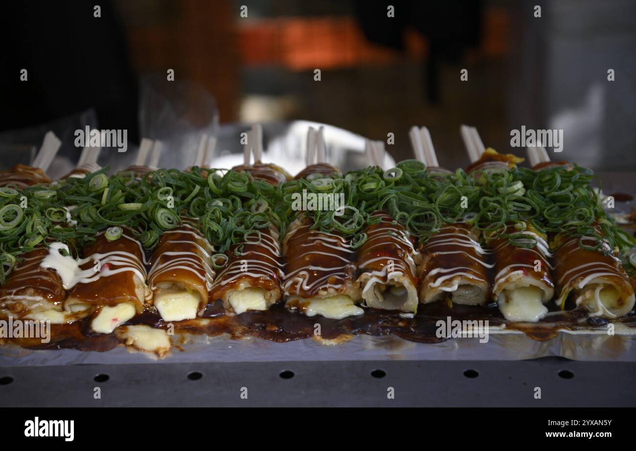 Display of the traditional savory crepes Hashimaki Okonomiyaki a ...